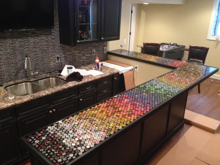 Man collects bottle caps to give kitchen stunning new look