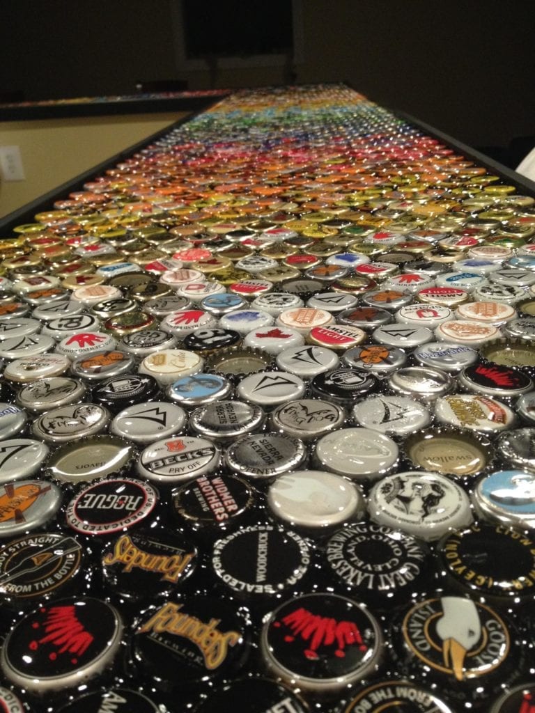 Man collects bottle caps to give kitchen stunning new look
