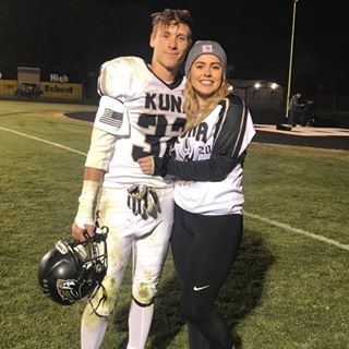 Crowd goes wild for high school football player who signs National Anthem