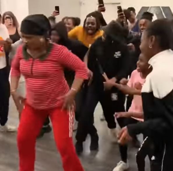 Mom is surrounded by dancers in a circle – then busts out moves that ...