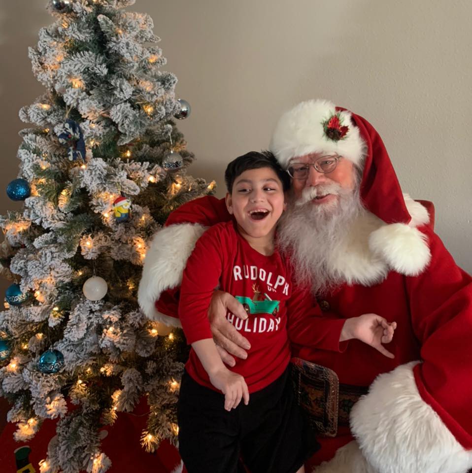 Special moment breaks out when Santa visits boy with special needs