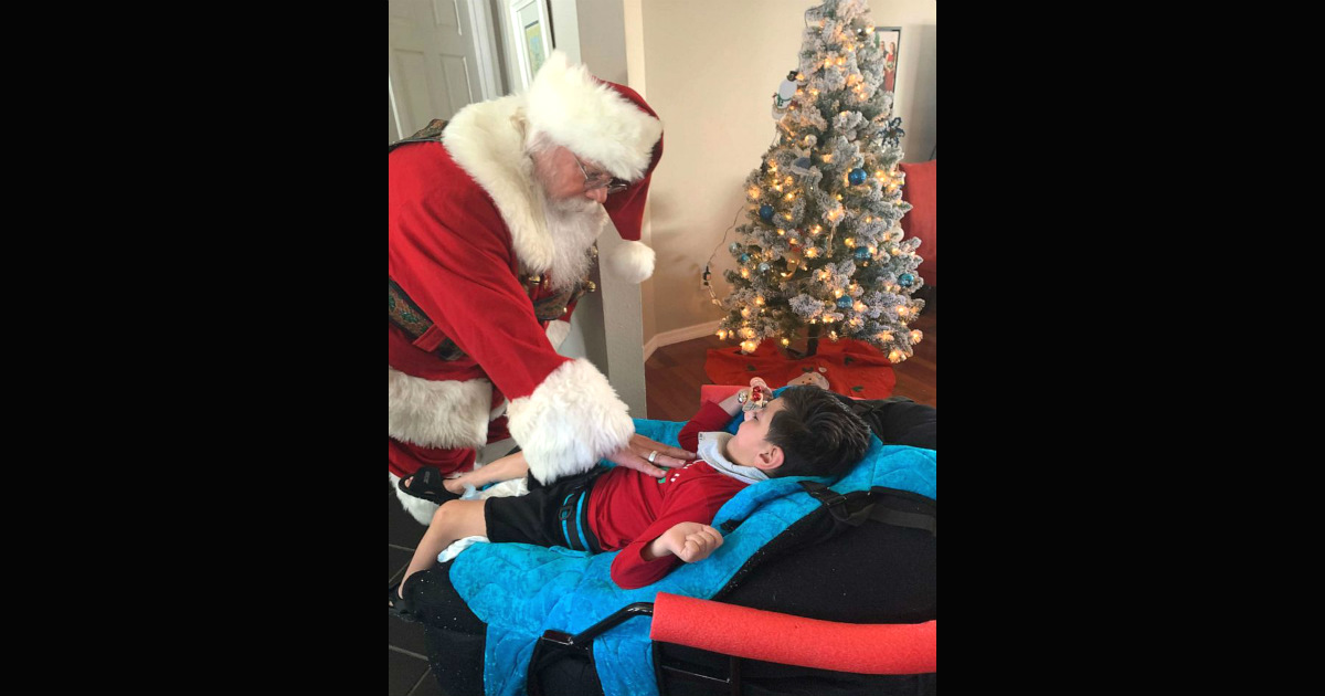 Special moment breaks out when Santa visits boy with special needs