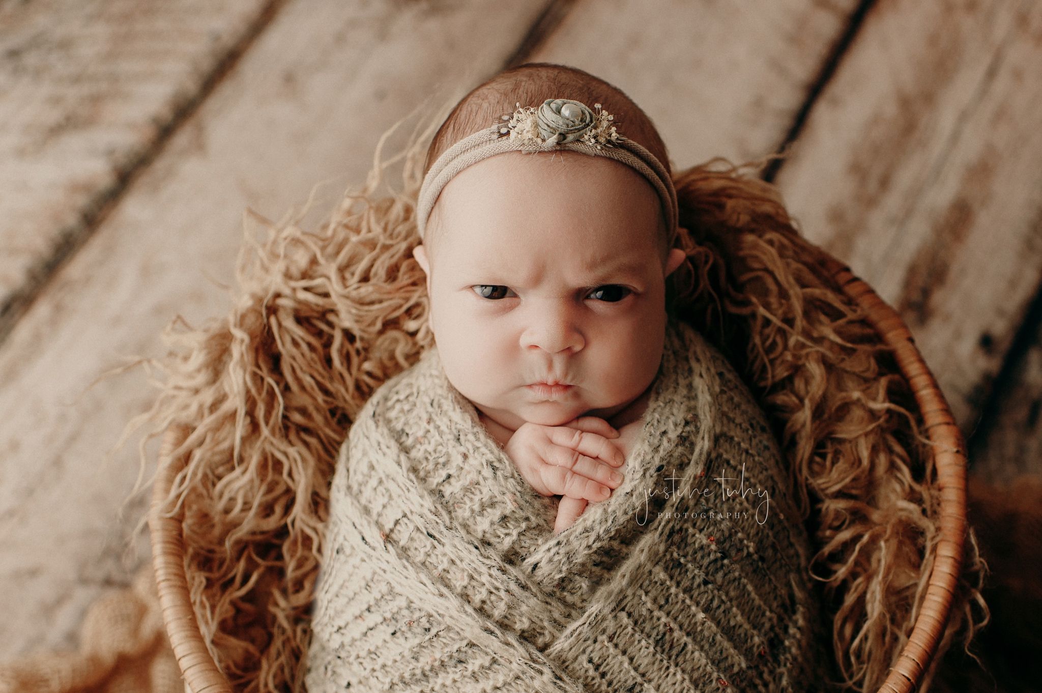 Newborn baby girl ‘mean mugs’ photographer during photoshoot