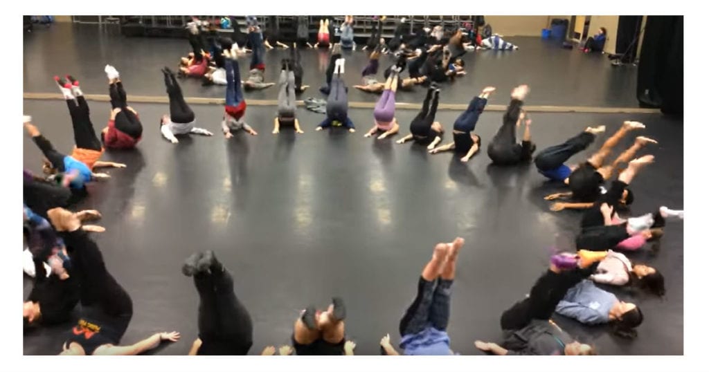 Group of dancers sit in a circle – tackle ‘impossible’ body percussion ...