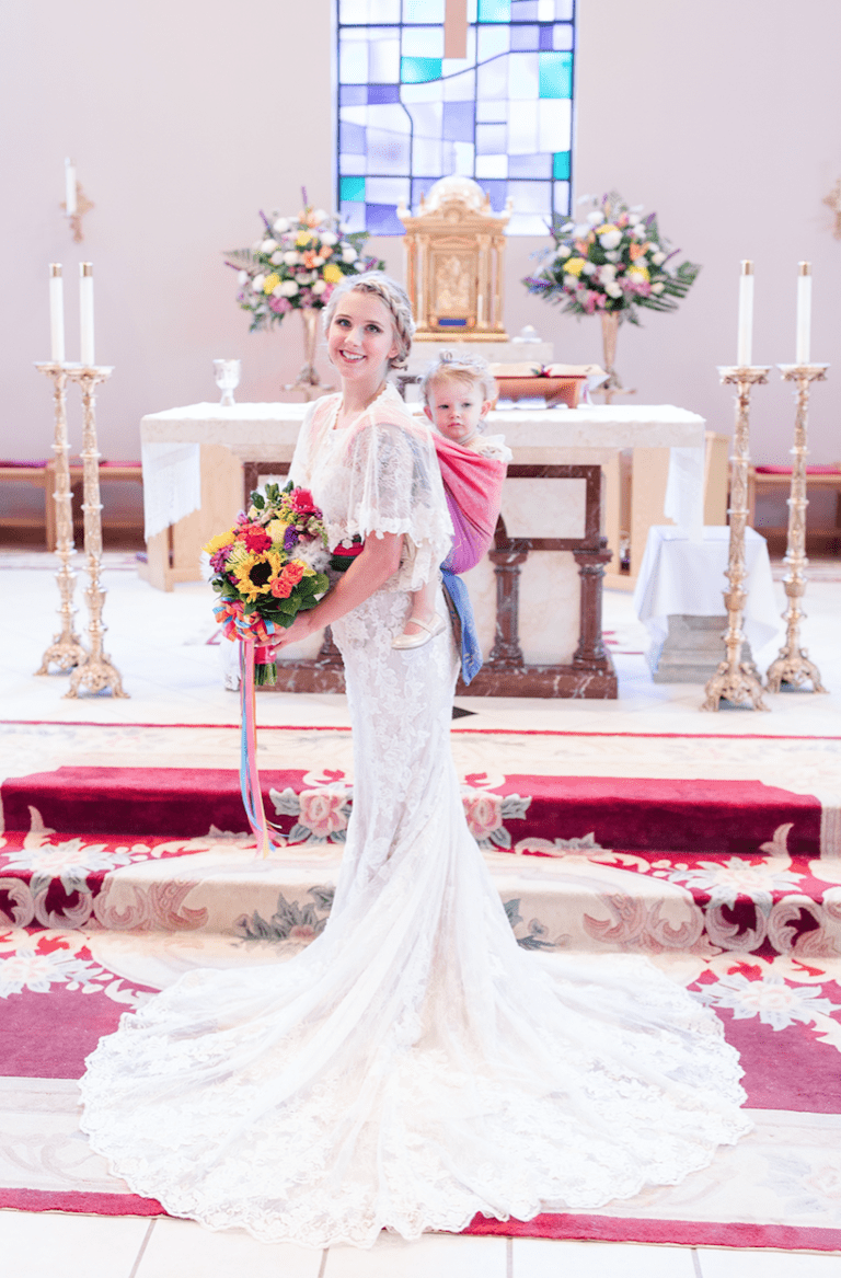Bride wears baby down the aisle and breastfeeds her while exchanging vows