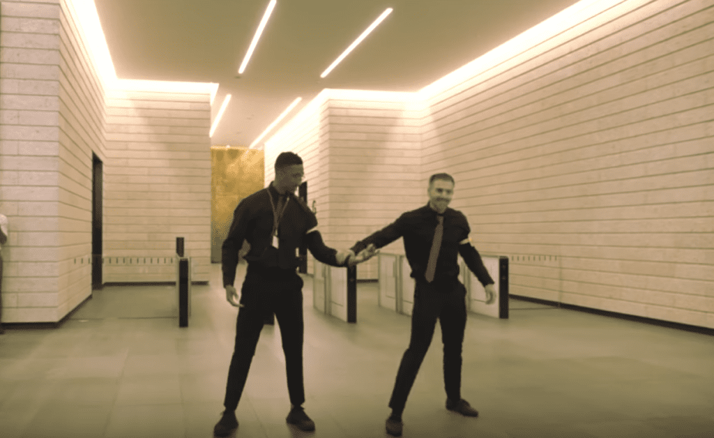 Workers gather around to cut ribbon for new office – then ’employee ...