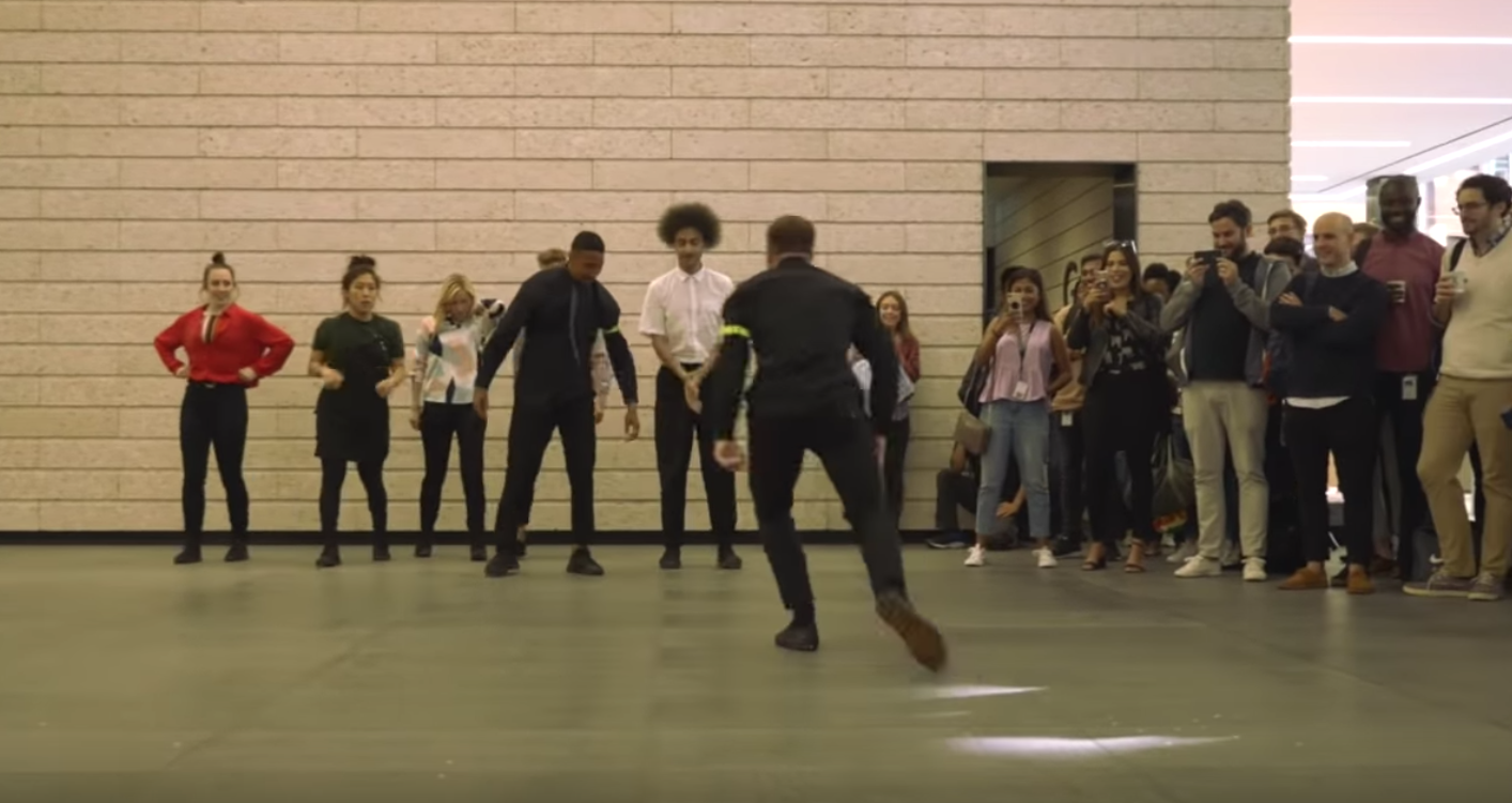 Workers gather around to cut ribbon for new office – then ’employee ...