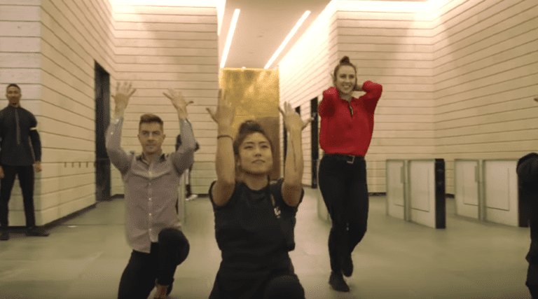 Workers gather around to cut ribbon for new office – then ’employee ...