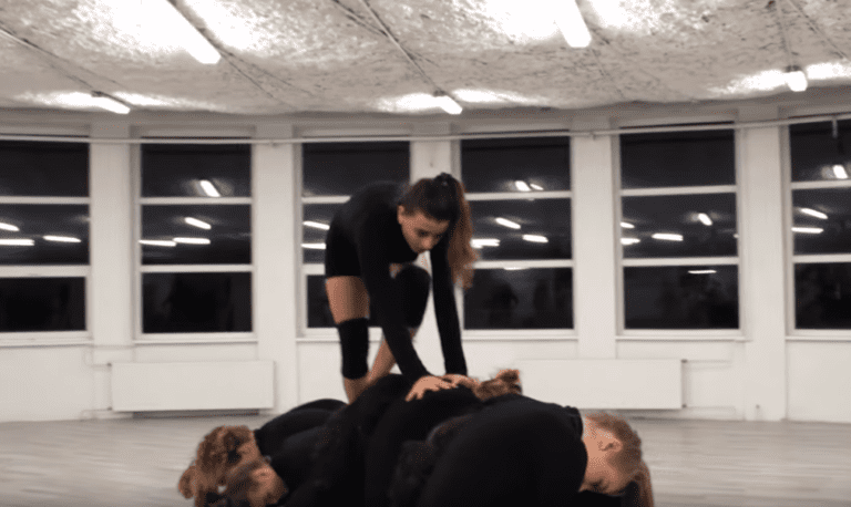 Army of girls catch free-falling dancer – then they take over dance ...
