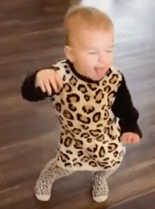 Baby girl starts twisting and shaking every time mom plays music