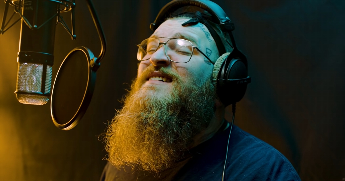 Bearded man with tattoos sings velvety smooth ‘You’re Still The One ...
