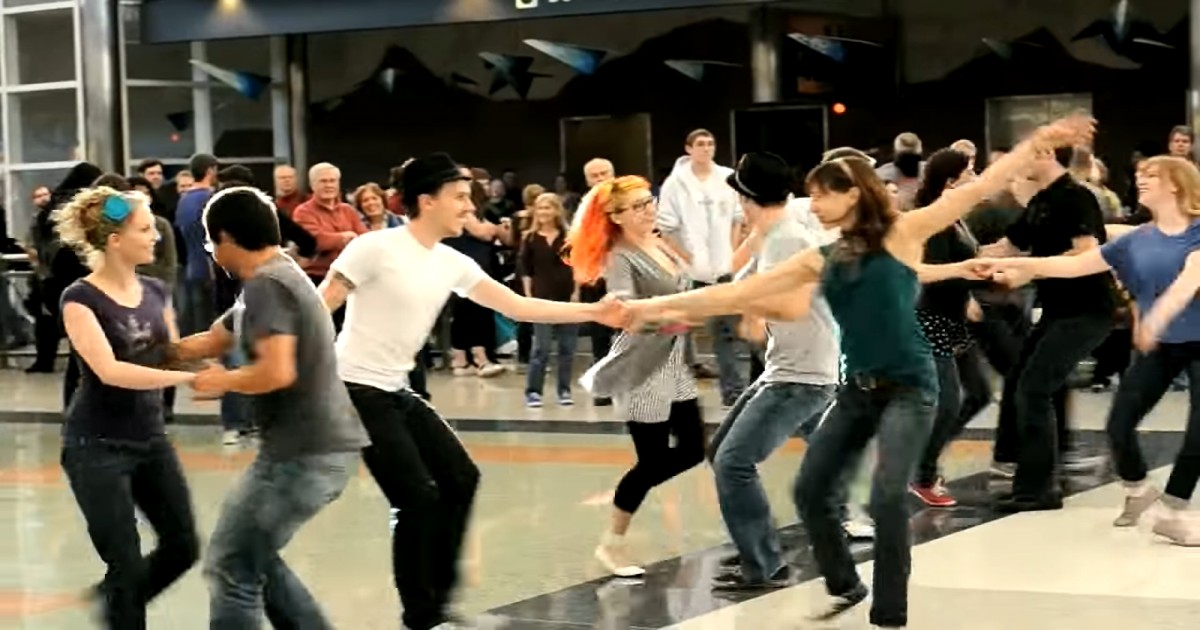Swing dancing flash mob takes over Denver airport in seconds of music ...