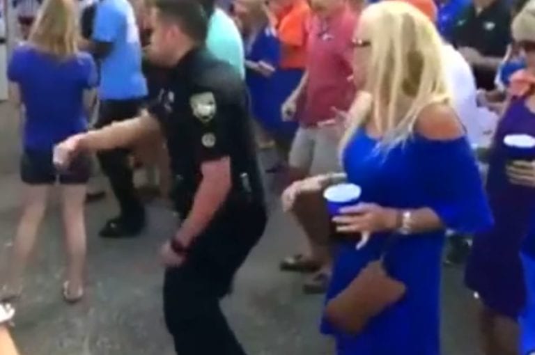 Cop can’t resist dancing along with the crowd when the Cupid Shuffle ...