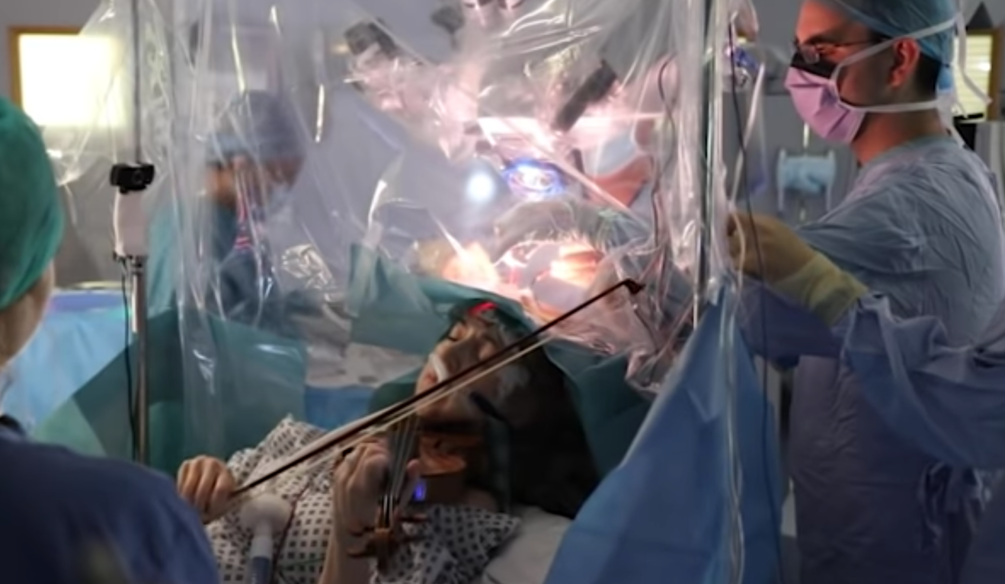 Incredible video shows musician playing violin during brain surgery to ...