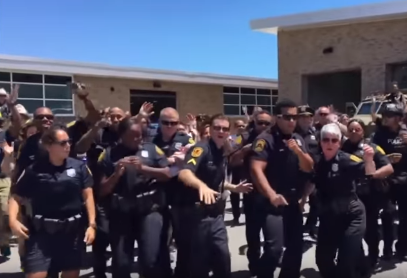 Handsome Police Officer Leads Dance Viewed By Millions
