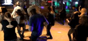 Handsome cowboy glides into party and steals the show with smooth line ...