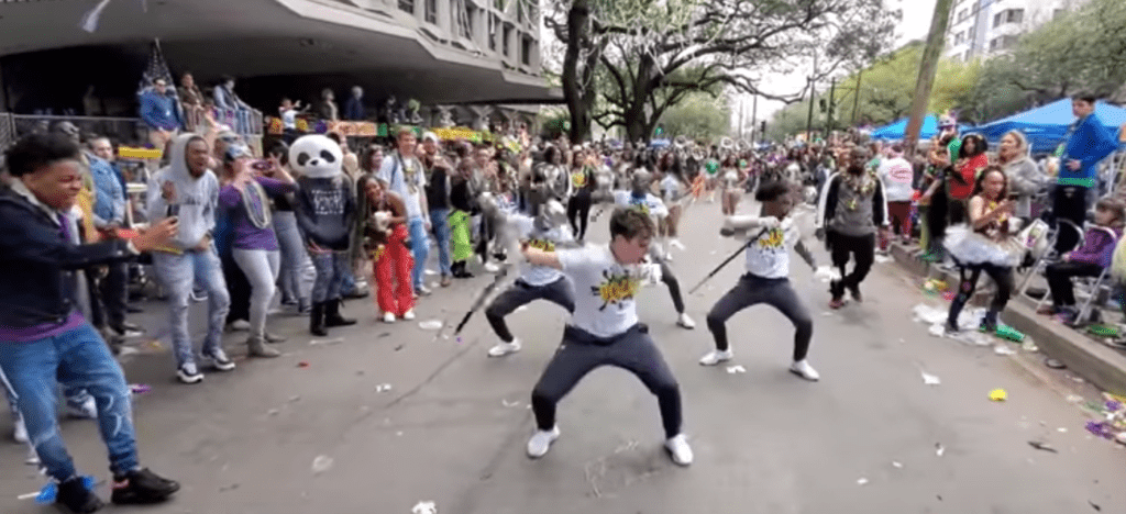High school marching band flies onto parade path with incredible routine
