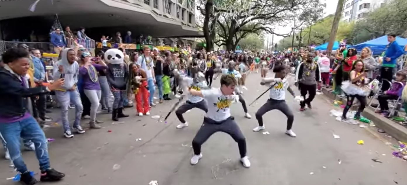 High school marching band flies onto parade path with incredible routine
