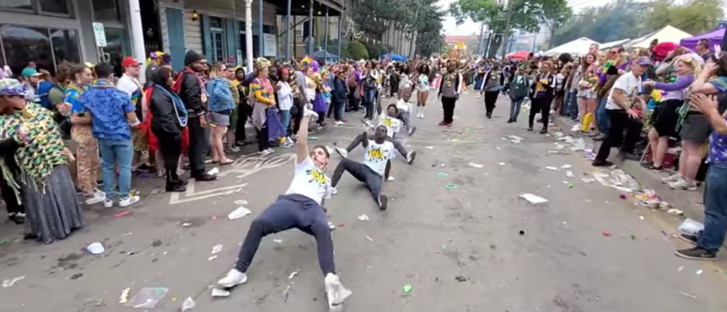 High school marching band flies onto parade path with incredible routine
