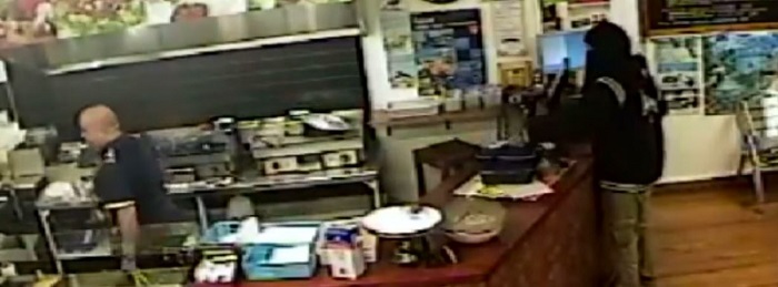 Armed robber walks out of shop annoyed when no one greets him