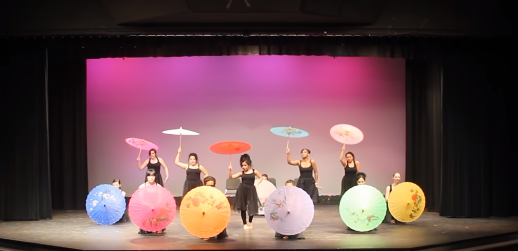 High school girls perform mesmerizing umbrella dance that will go down ...