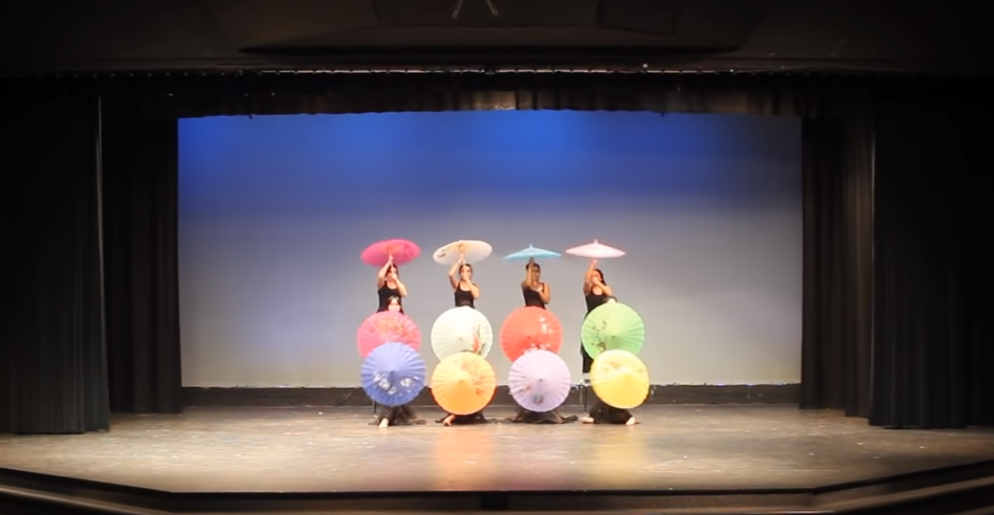 High school girls perform mesmerizing umbrella dance that will go down ...
