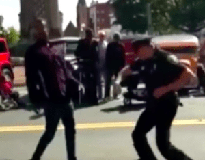 Cop challenges street performer to an epic battle