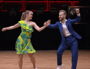 Young Couple Light Up The Room With Fun Swing Dance