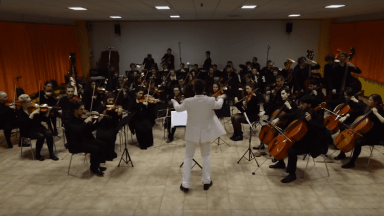 Orchestra director’s dance moves are just as exciting as the band’s ...