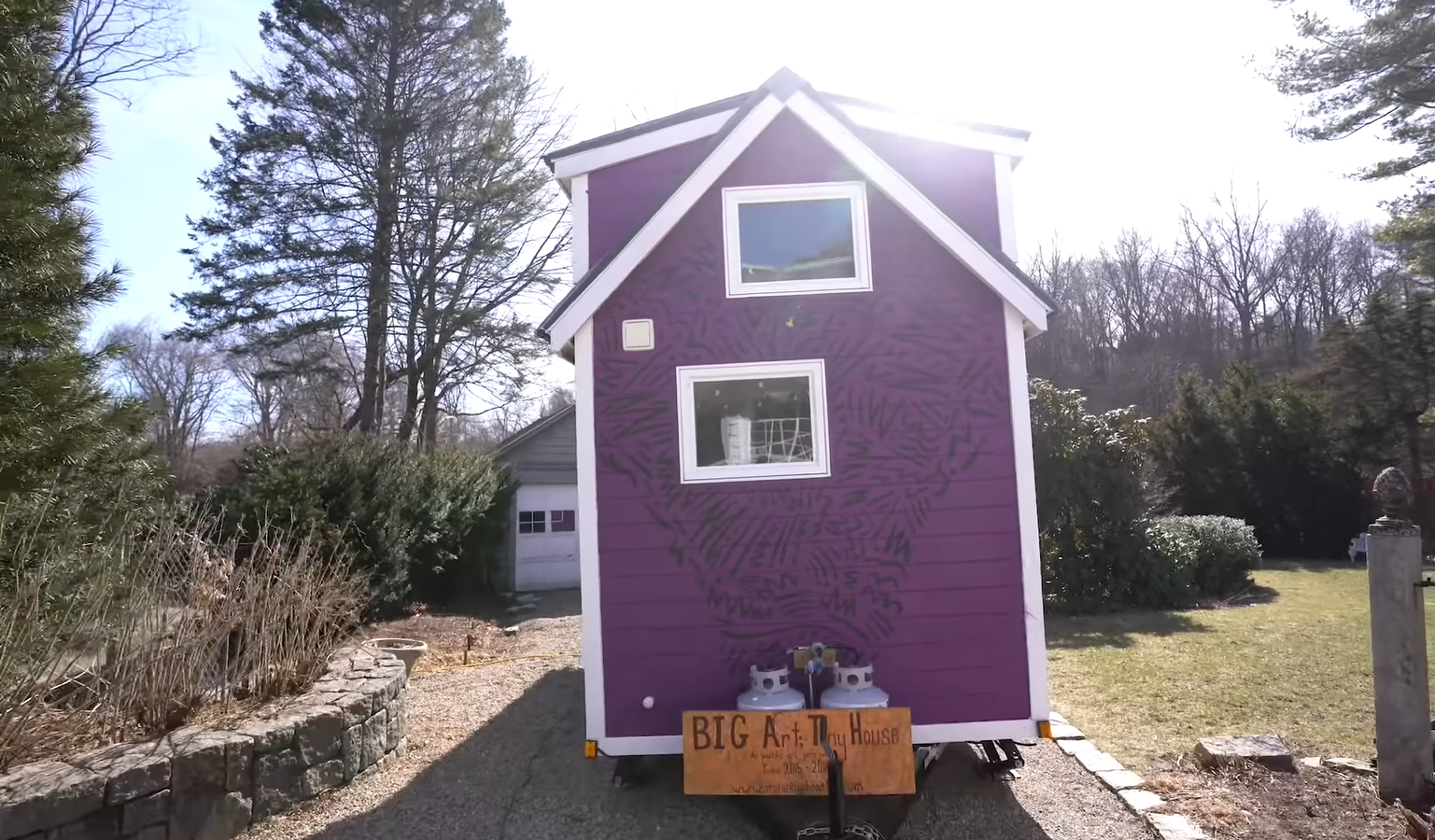 Woman gives a tour of her artsy tiny home built set designer mom’s help