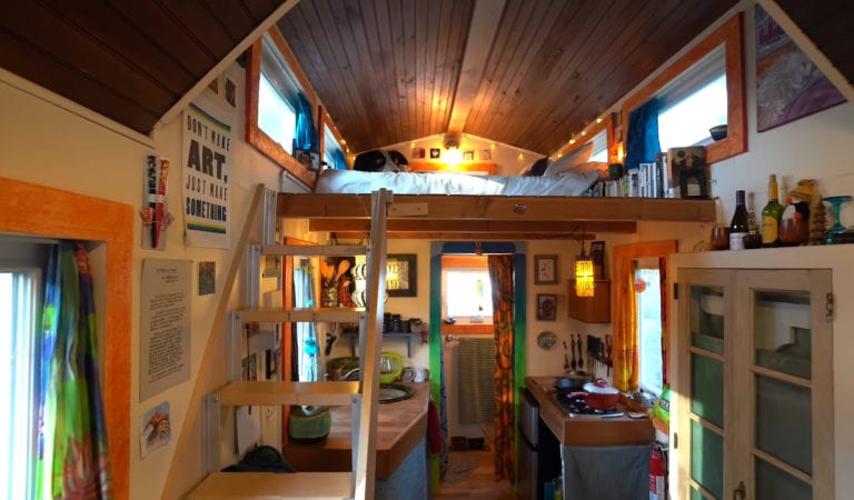 Woman gives a tour of her artsy tiny home built set designer mom’s help