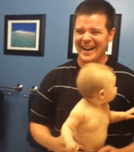 Baby And Daddy Have Adorable Muscle Flexing Contest