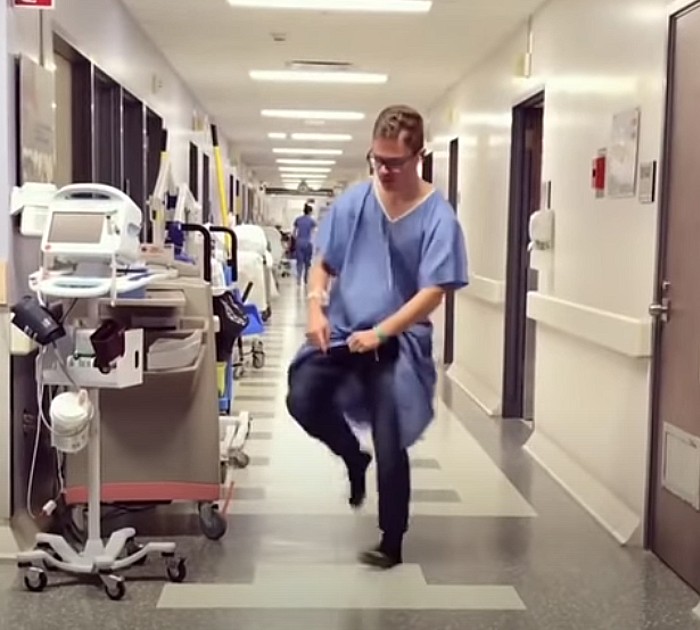 Man celebrates being discharged from hospital by breaking out in a ...