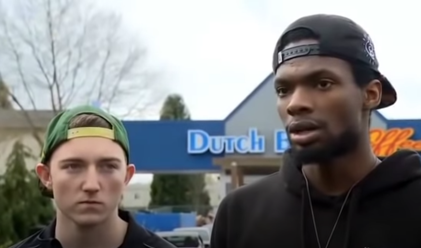 Caring teens reach hands out to pray with crying woman at drive-thru