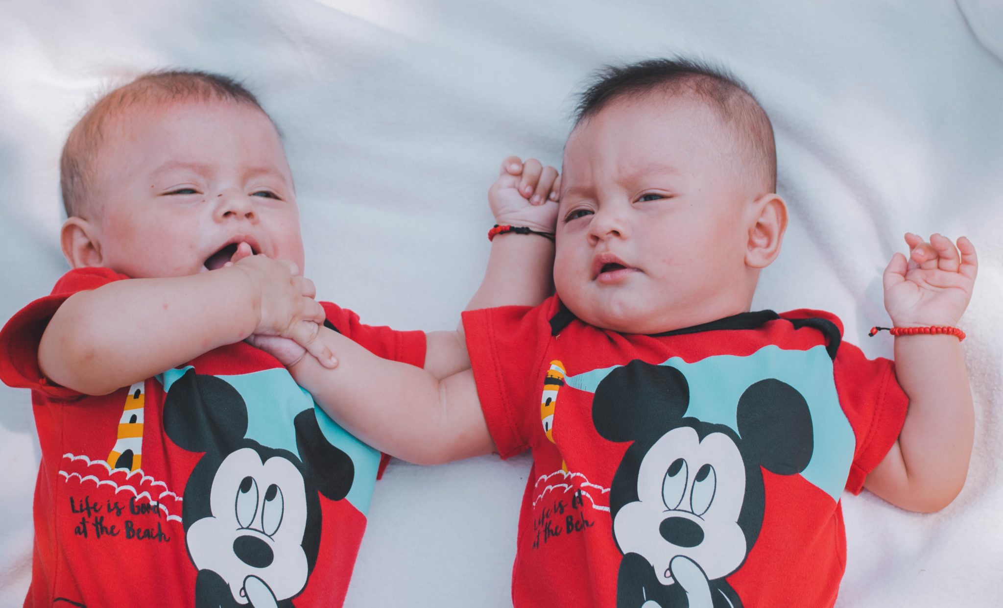 8-month old twin babies have sweetest dance moves for singing mom