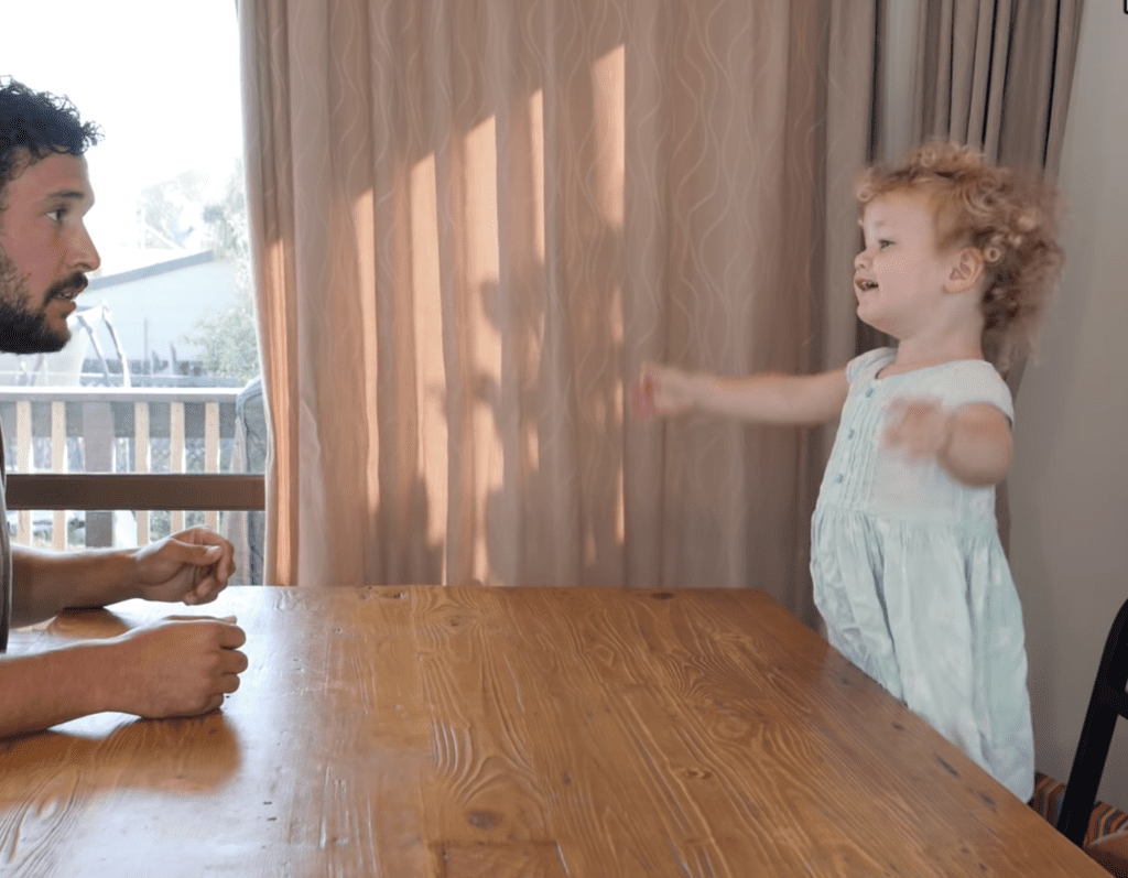 Dad Gives Hilarious Tutorial Teaching Toddler To Sing