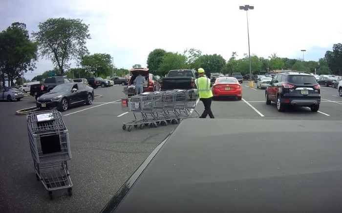 Supermarket employee struggles with shopping carts & manages to hit ...