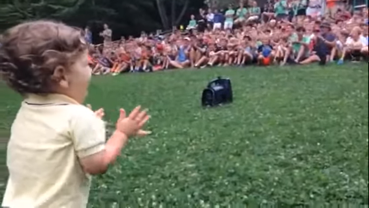 In-charge toddler shows teen boys how to command a crowd