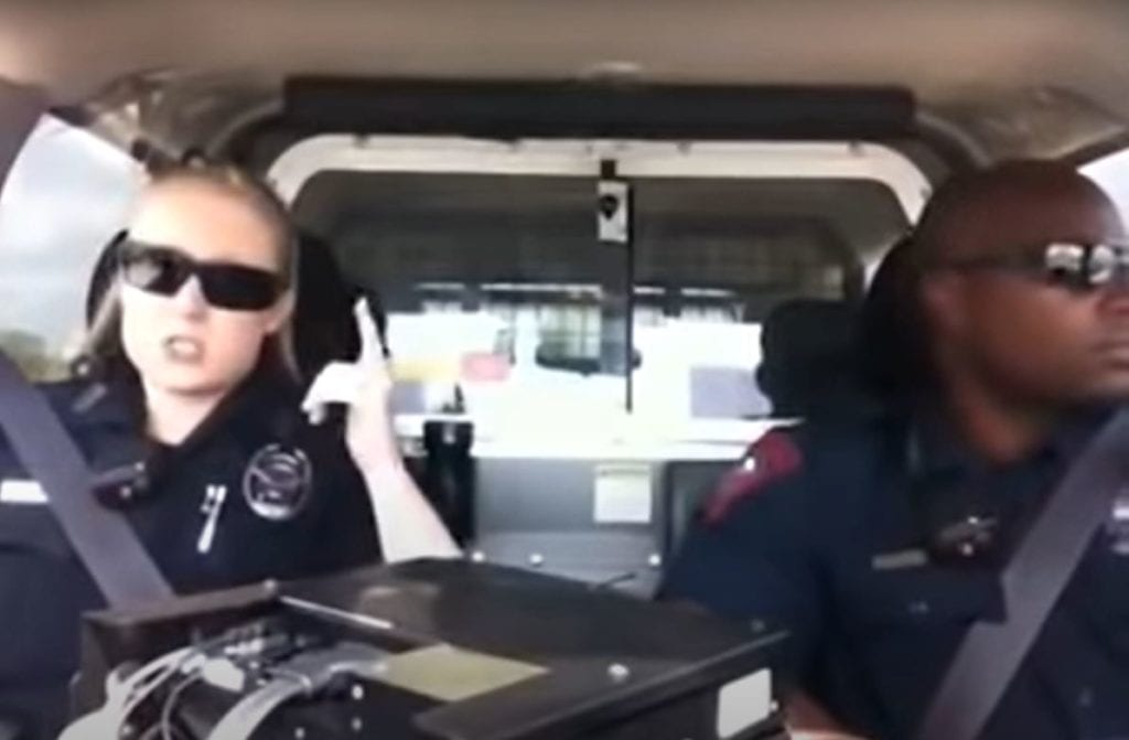 Camera catches cops lip-syncing on the job