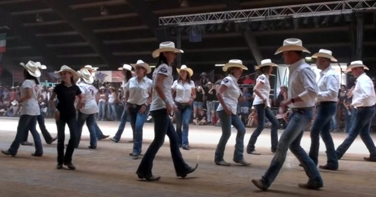 100+ performers do rollicking country line dance in sync