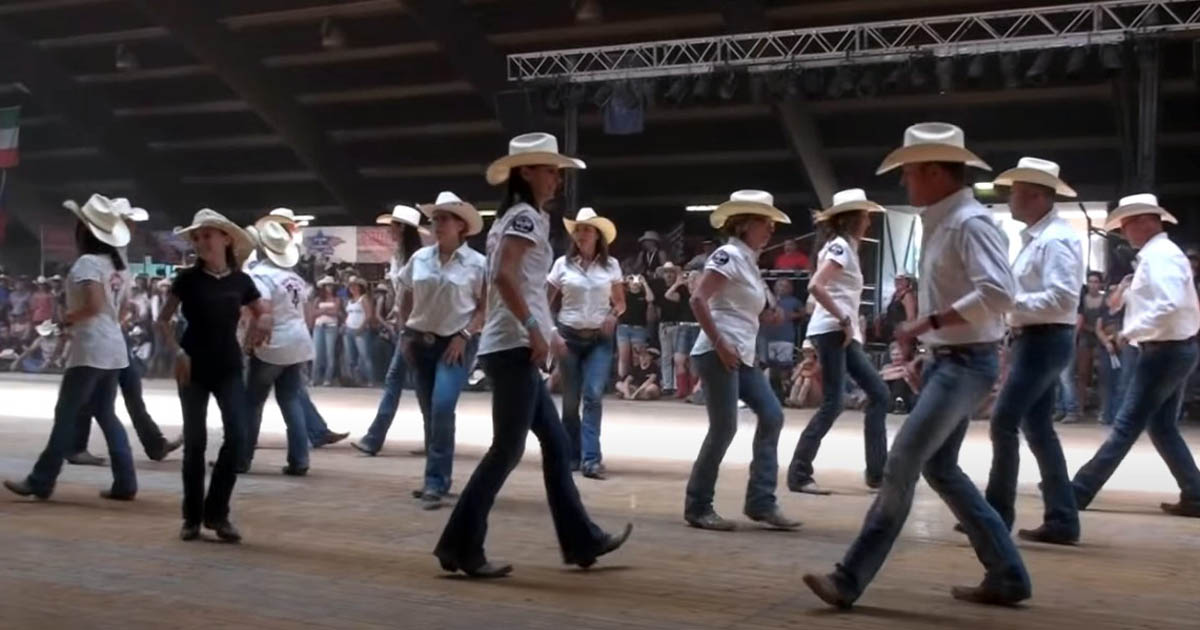 100+ performers do rollicking country line dance in sync