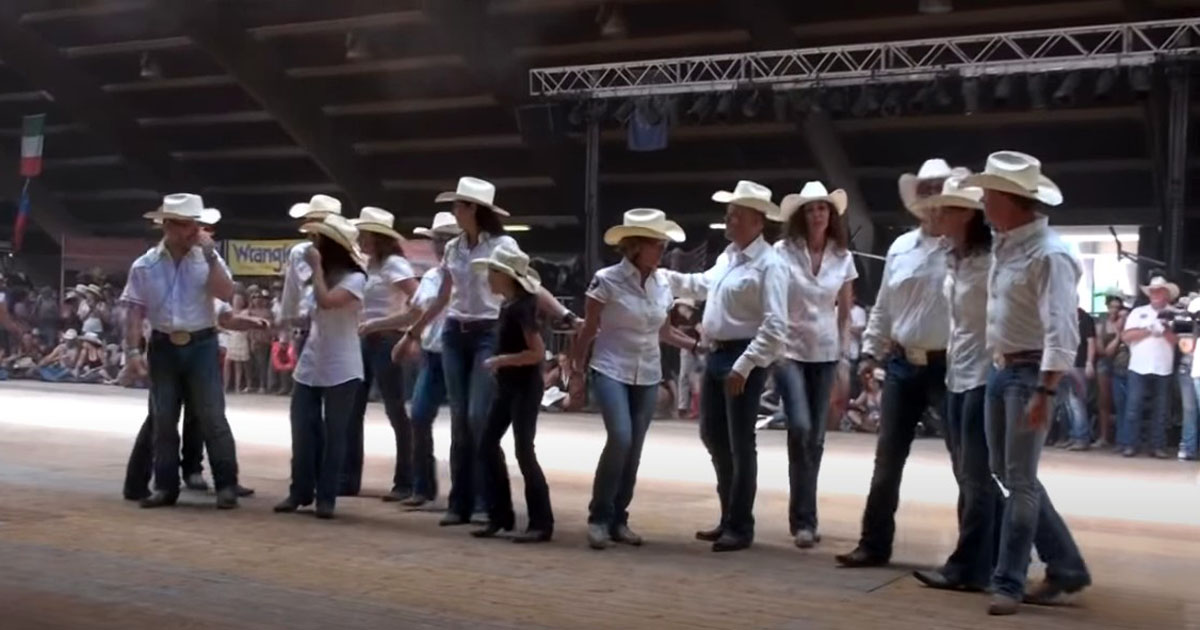 100+ performers do rollicking country line dance in sync