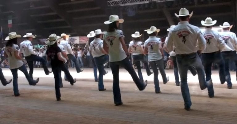 100+ performers do rollicking country line dance in sync