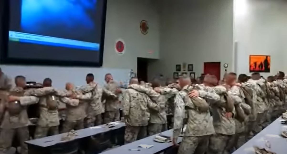 American Marines stand together. Lift voices to sing ‘Days of Elijah’