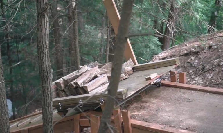 Man builds tiny home from scratch on top of mountain with no roads