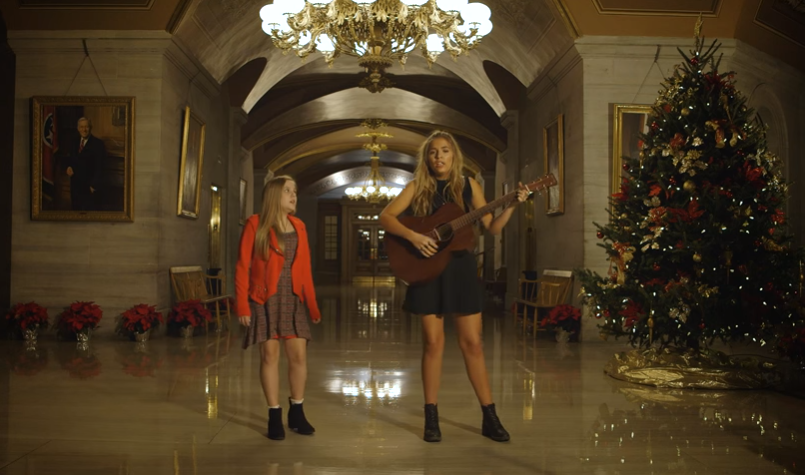 Sisters light up the room with angelic rendition of “Silent Night”