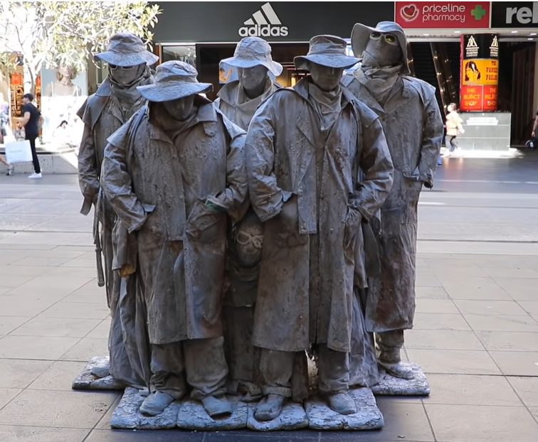 Teen challenges 'statue' to dance-off and crowd gathers to watch in awe