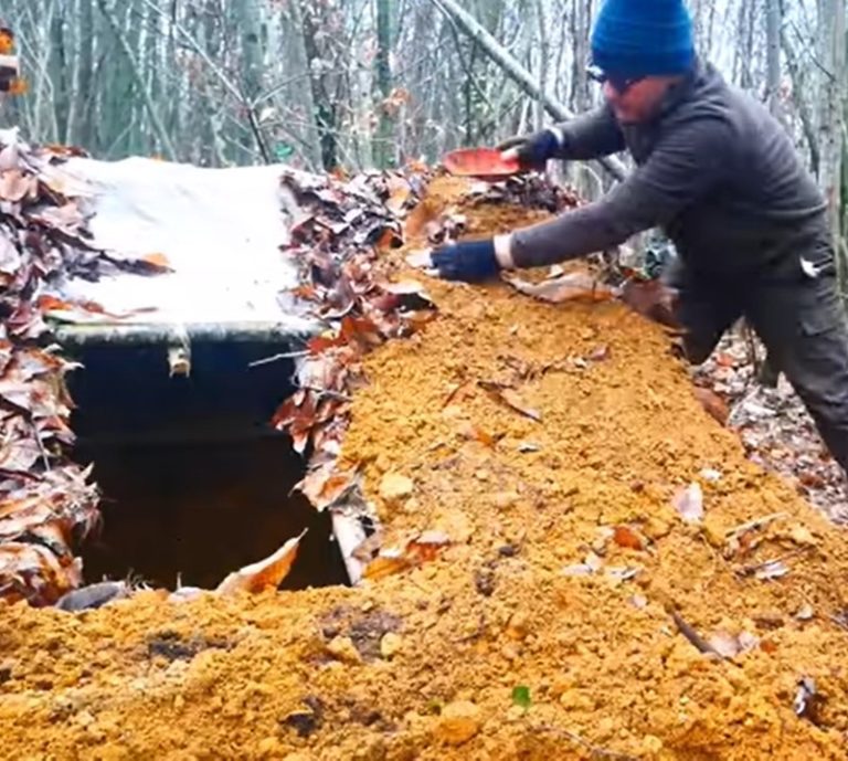 Bushcrafter shows how to build warming forest pit shelter with simple tools