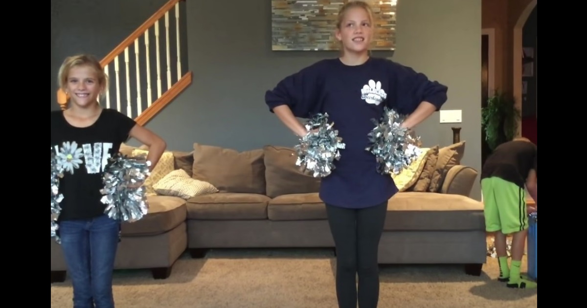 Little bro hilariously snatches the spotlight during sisters’ cheer ...