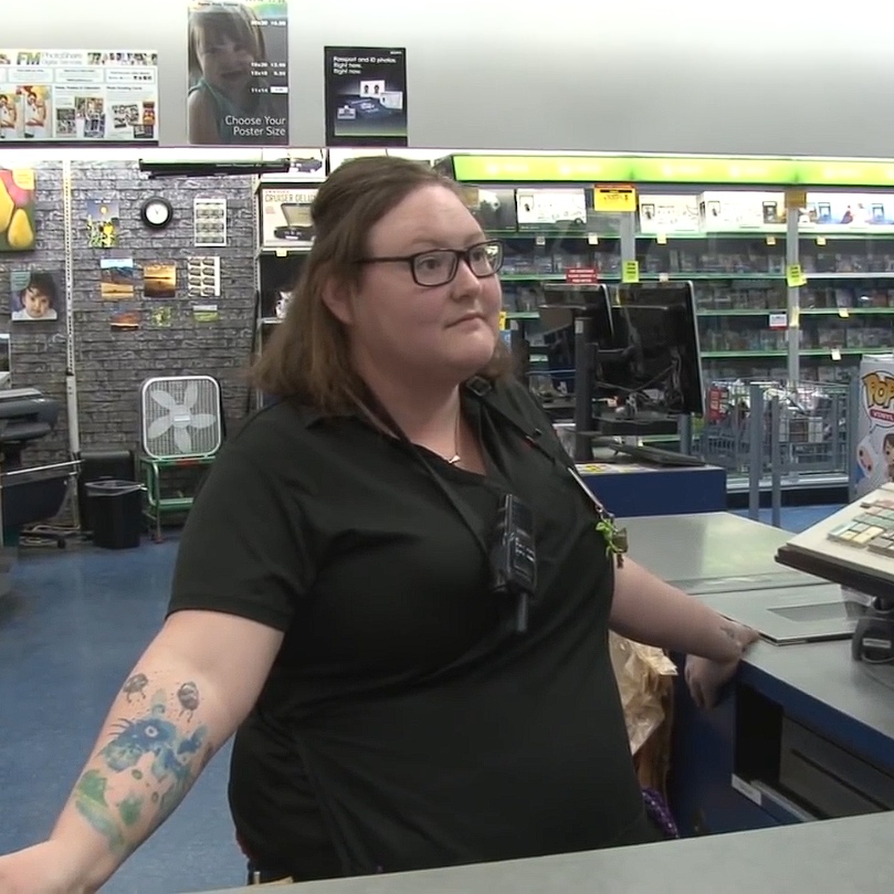 Cashier steps in after woman on phone tries to purchase gift cards